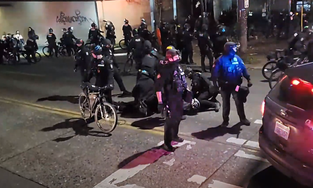 Protesters march in Seattle for 21st anniversary of WTO riots ...